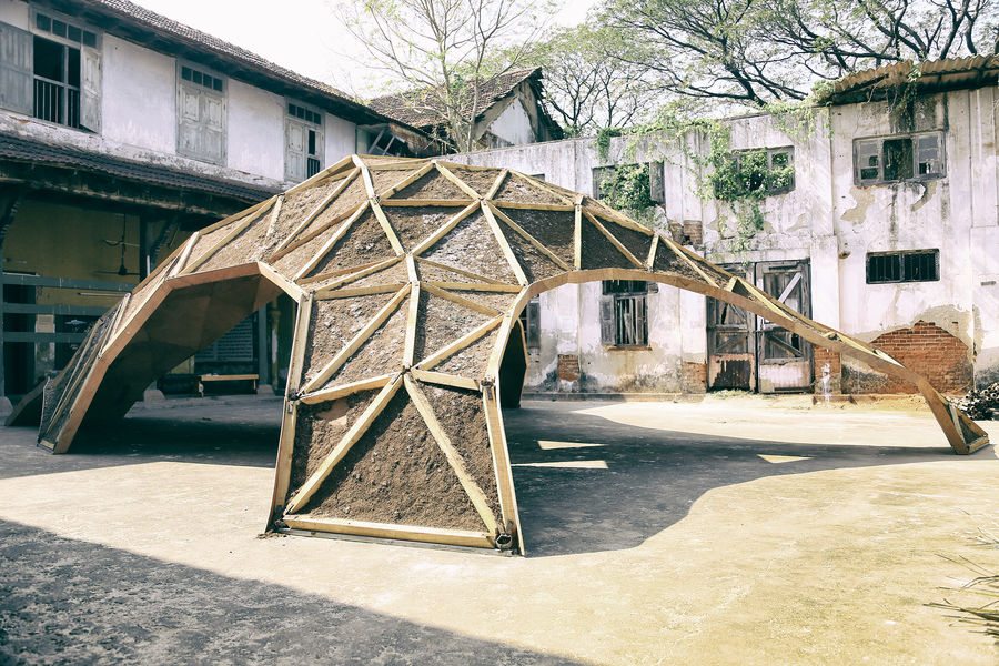 Curved wood roof by john otunga | ArchDaily